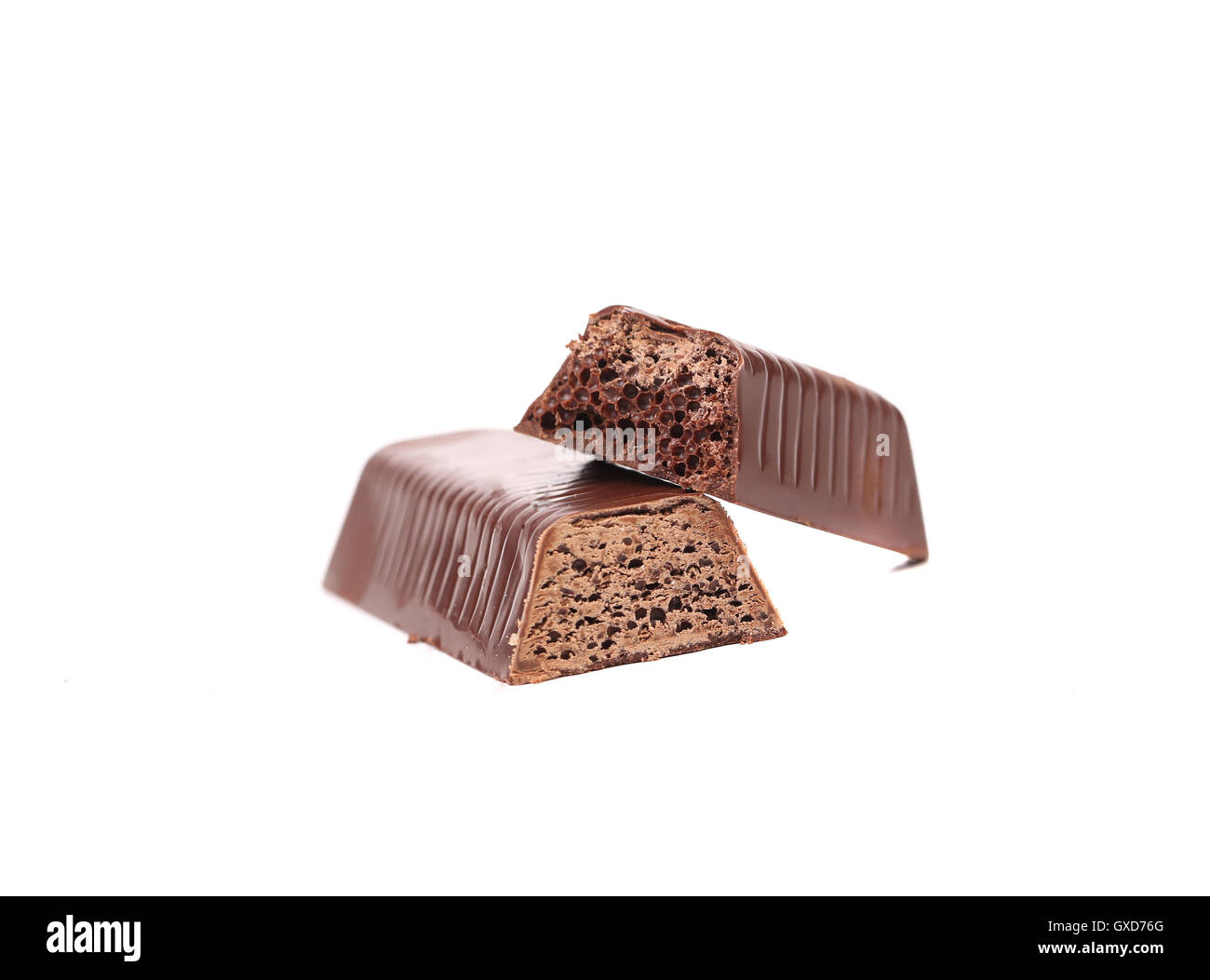 Broken bar of chocolate on a white background Stock Photo - Alamy