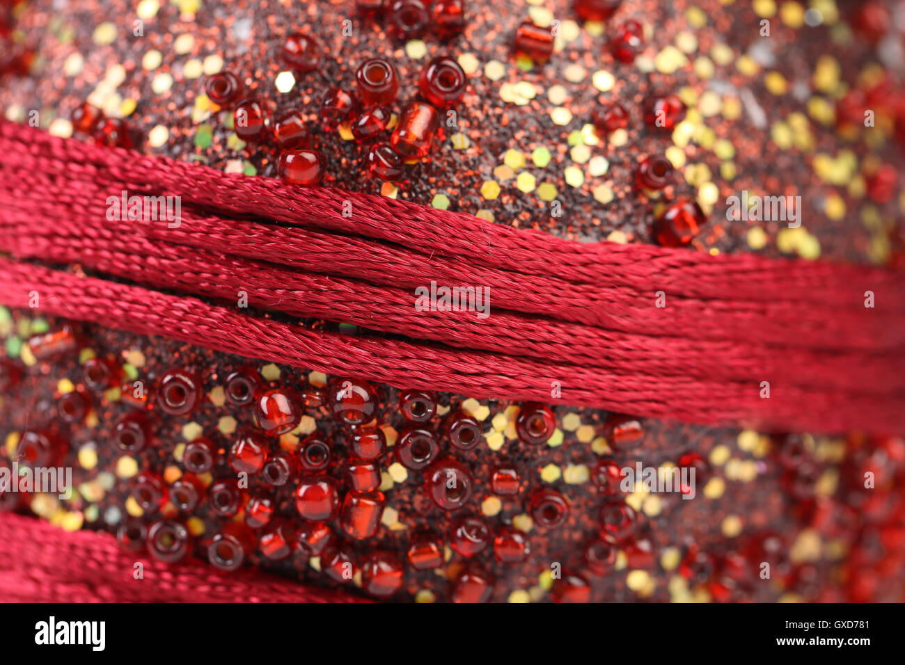 Background of beads and red threads Stock Photo - Alamy