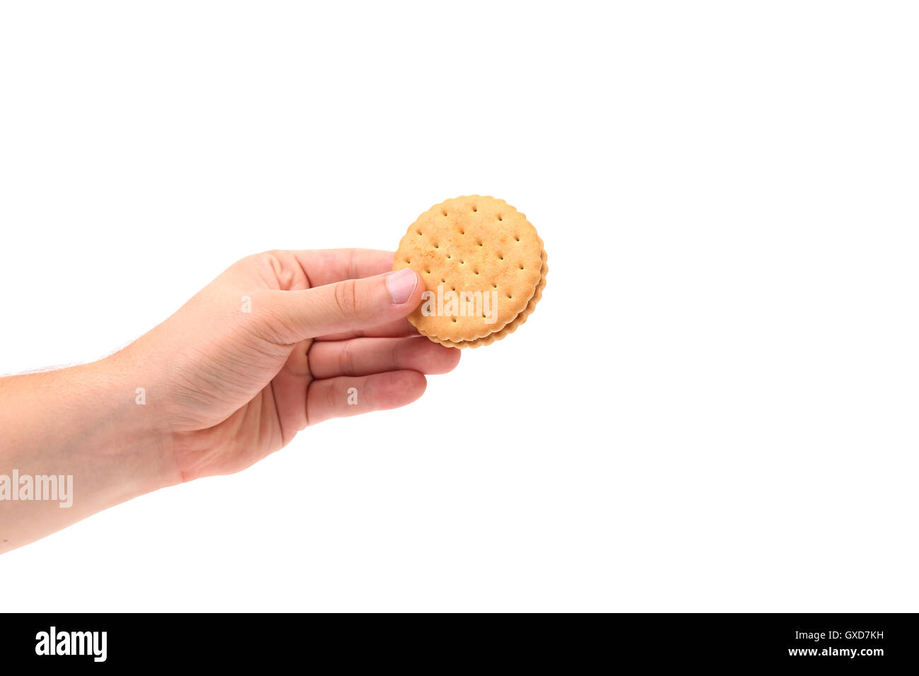 Hand holds cookie biscuits with filling Stock Photo - Alamy
