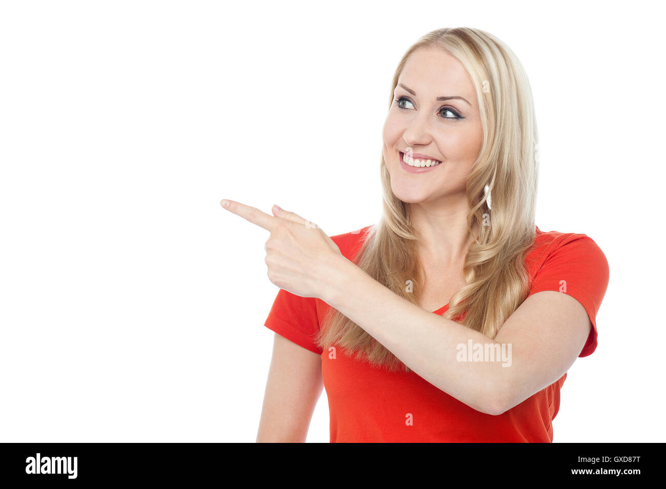 Beautiful woman pointing at something Stock Photo - Alamy
