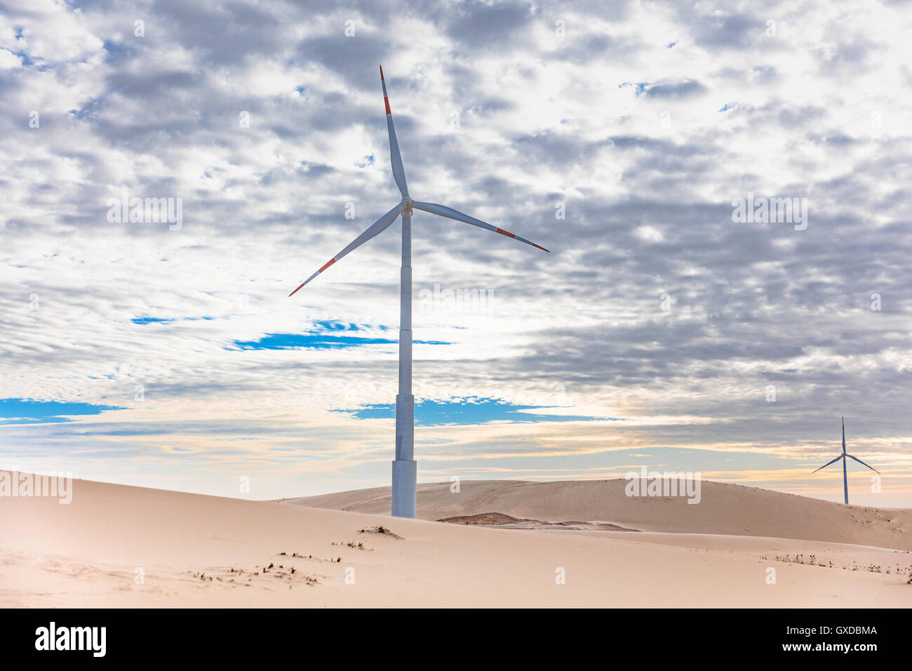 Two wind turbines in desert landscape, Taiba, Ceara, Brazil Stock Photo ...