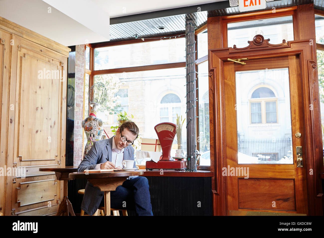 Sitting writing document table hi-res stock photography and images - Alamy