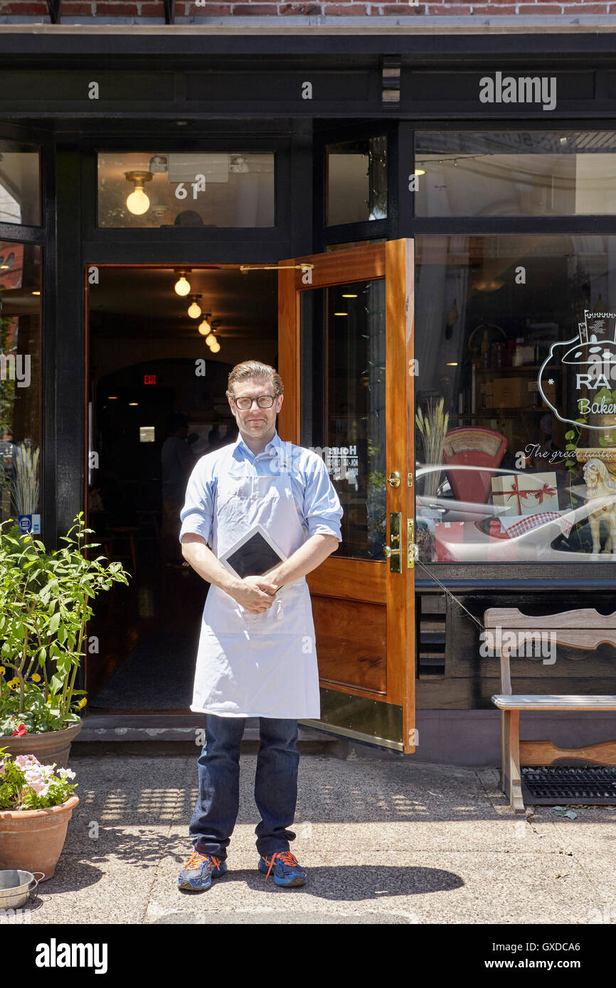 Owner standing outside coffee shop hi-res stock photography and images ...