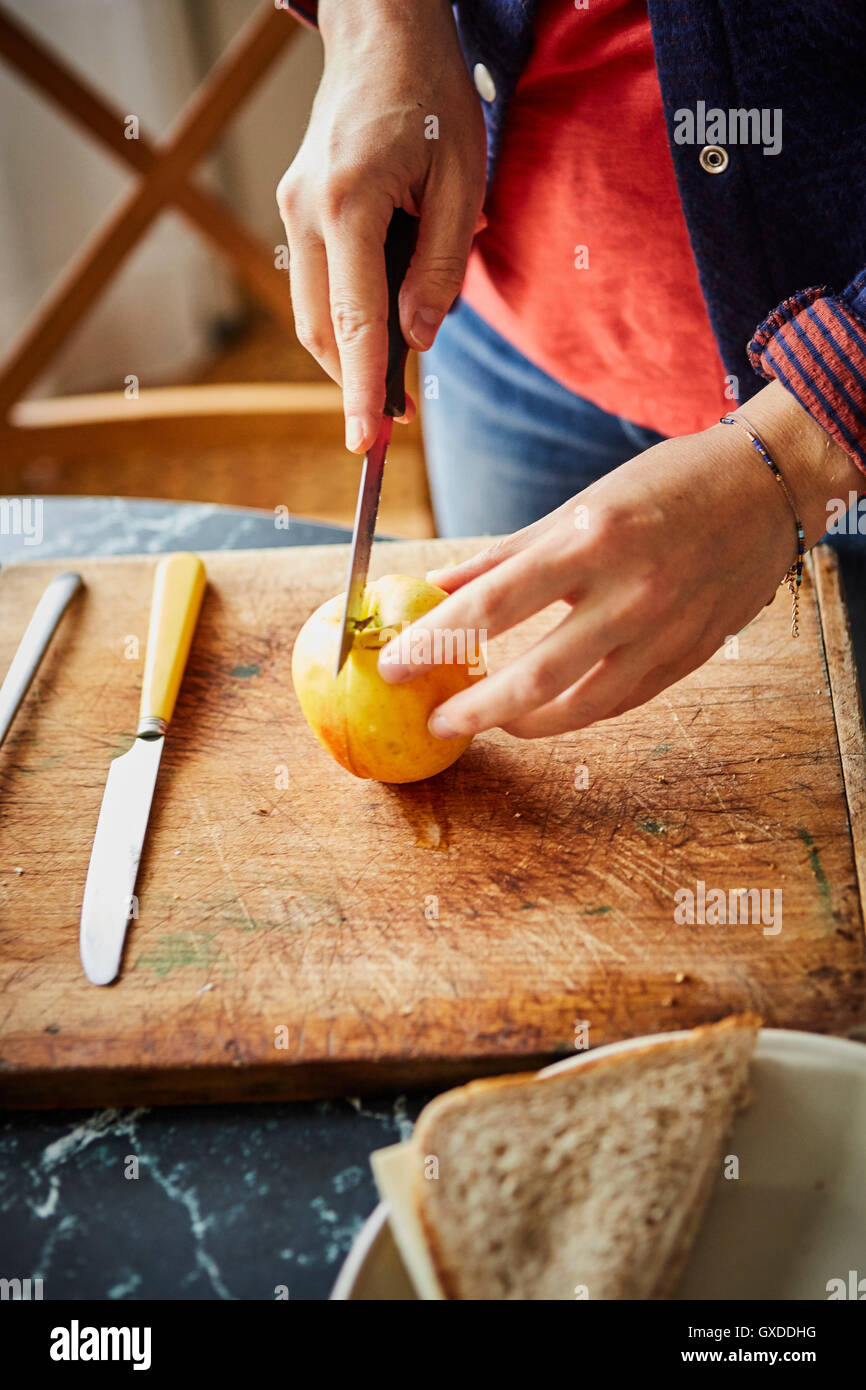 Woman cutting baked apple hi-res stock photography and images - Alamy