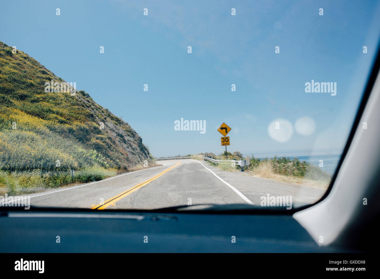 Car windscreen view of winding coast road, Big Sur, California, USA ...