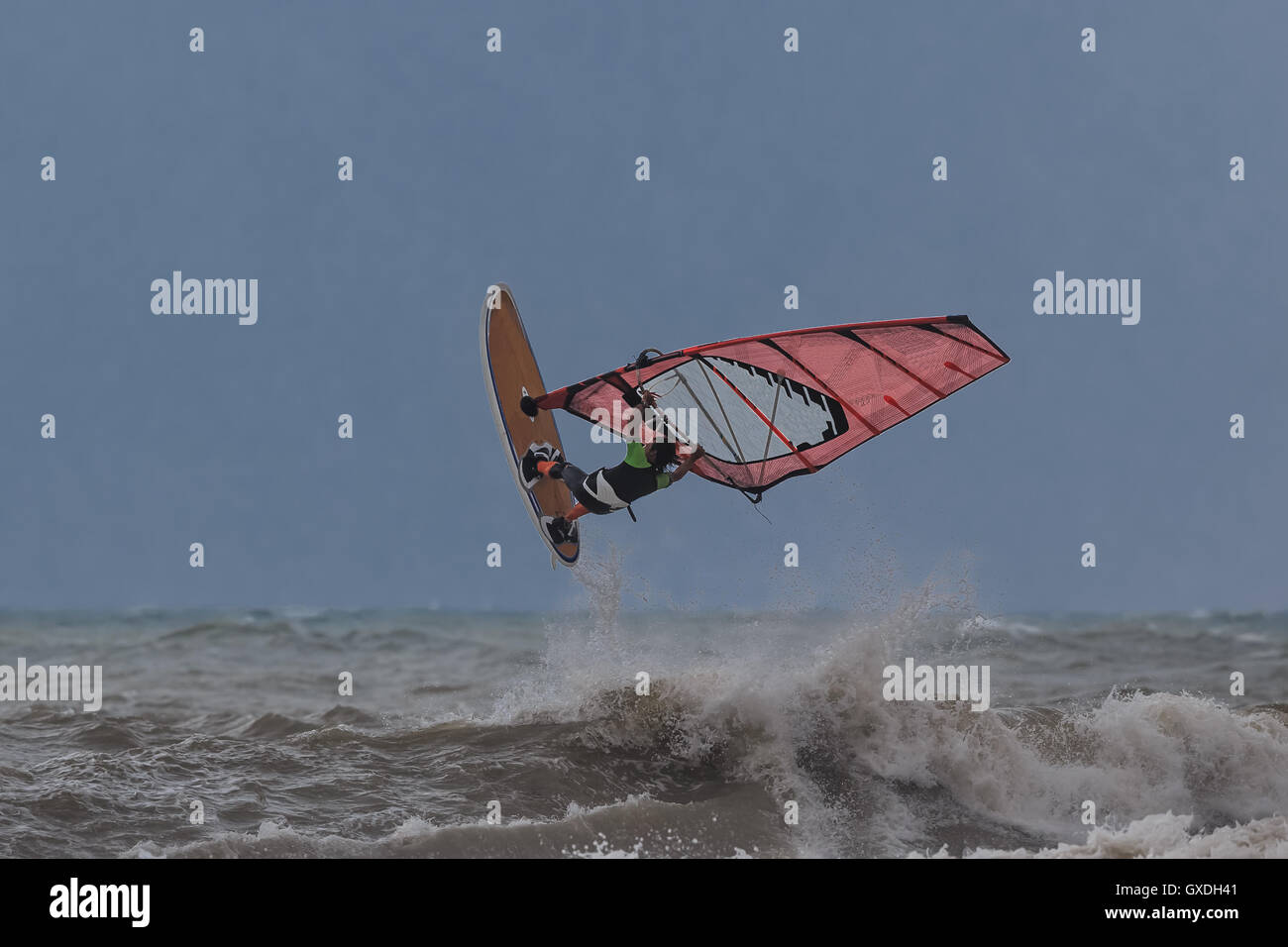 Flying the waves windsurfing Stock Photo - Alamy