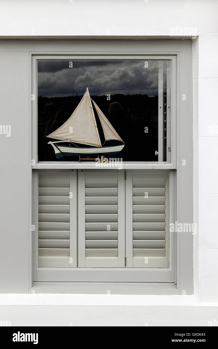 Small wooden sail boat in the window of a house, Berwick-upon-Tweed ...
