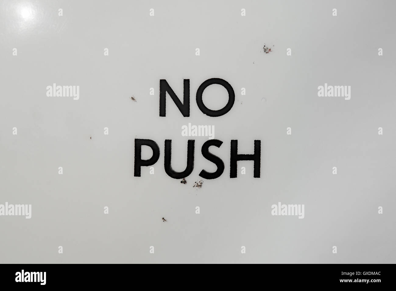 NO PUSH sign on a plastic nose radar dome of a modern aircraft with ...