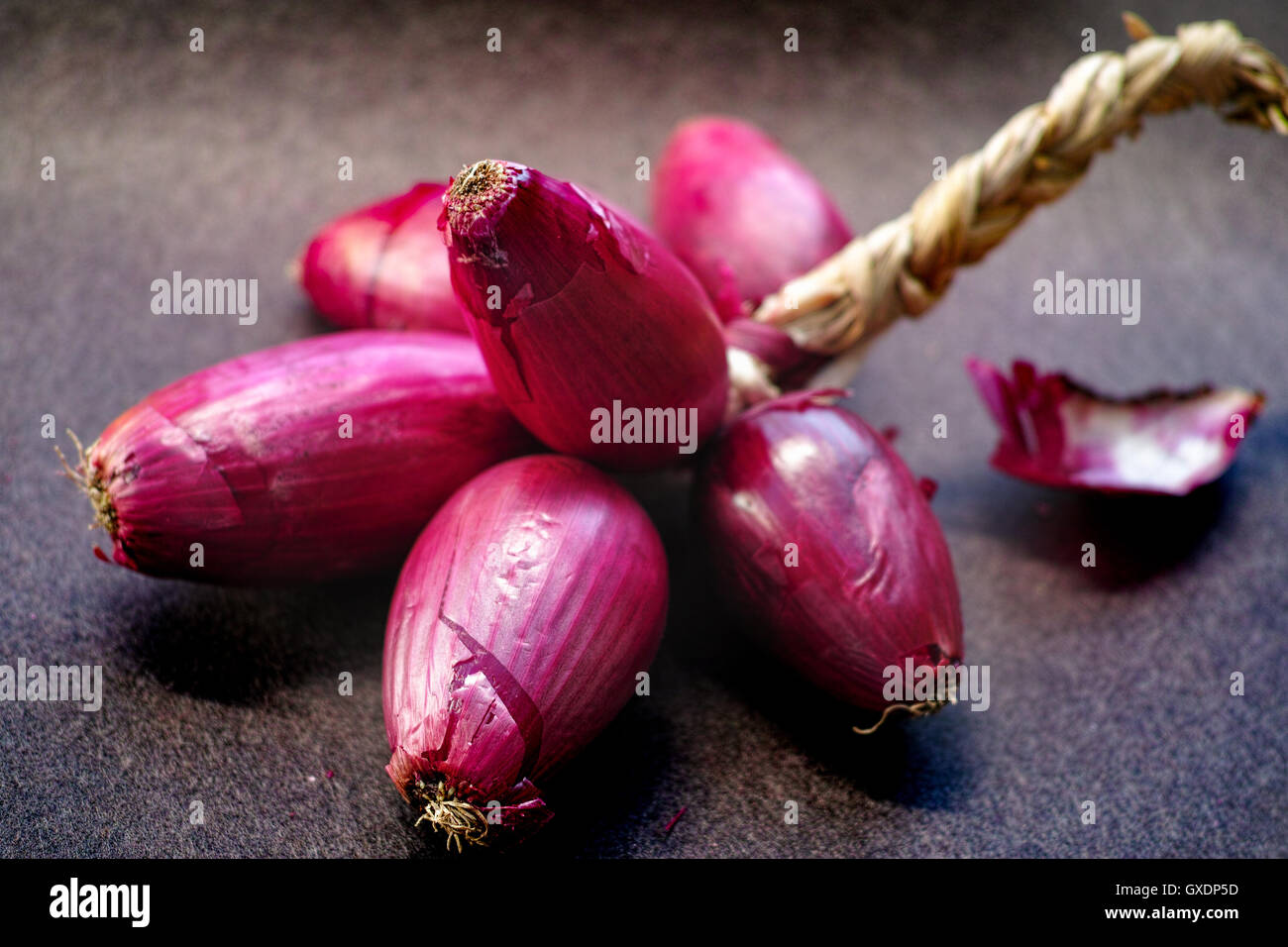 Pink Rose italian onion braid on gray background Stock Photo - Alamy