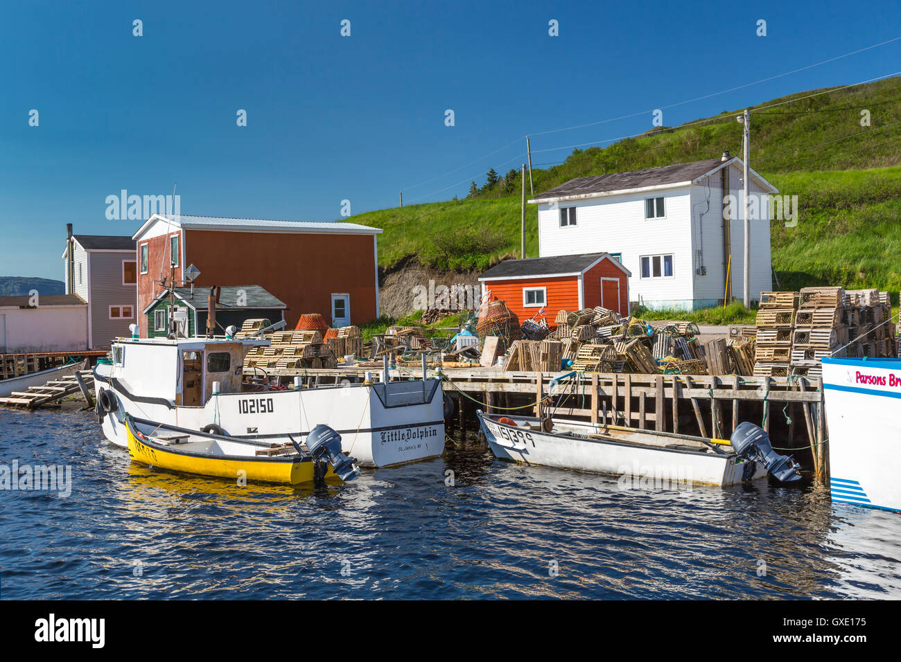 The harbor, fishing boats and colorful fishing stages in Trout River ...
