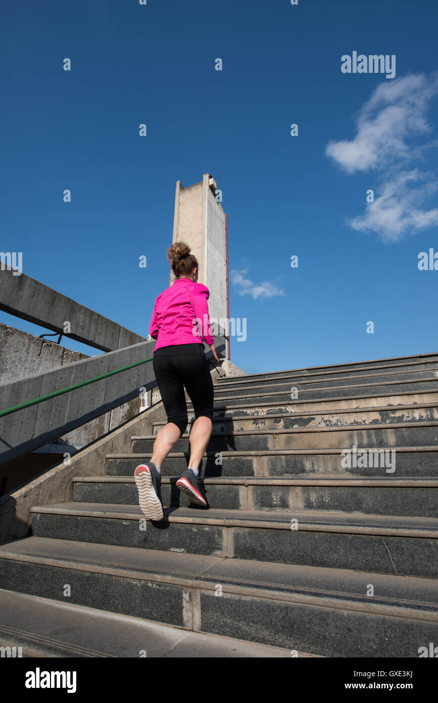 healthy young couple jogging on steps at early morning Stock Photo - Alamy