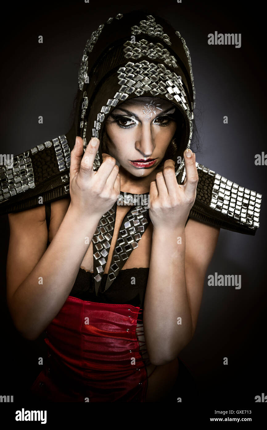Strong dance, Beautiful brunette woman in armor formed by mirror Stock ...