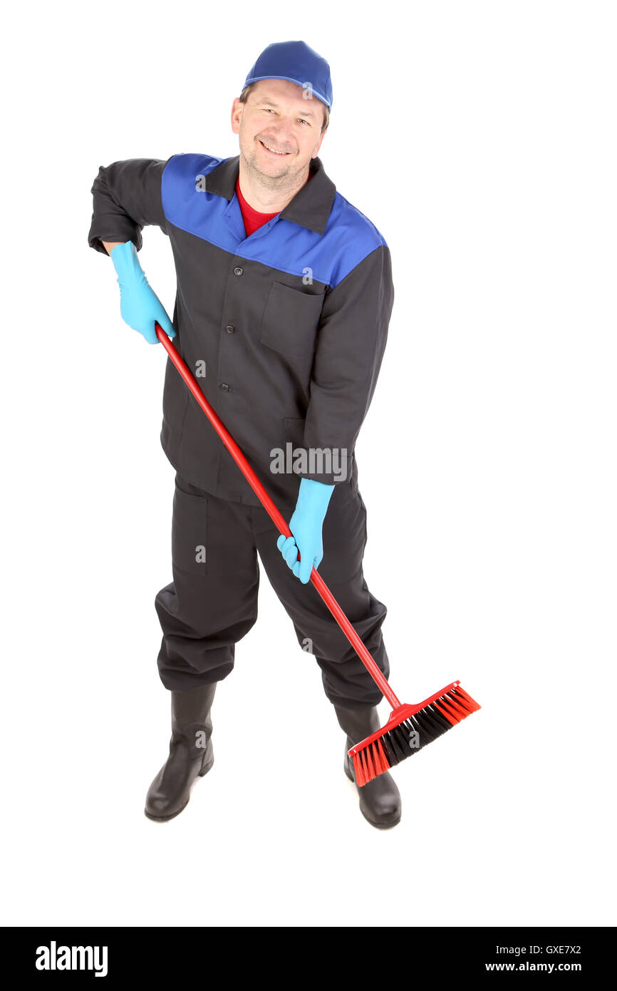 Man with cleaning broom Stock Photo - Alamy
