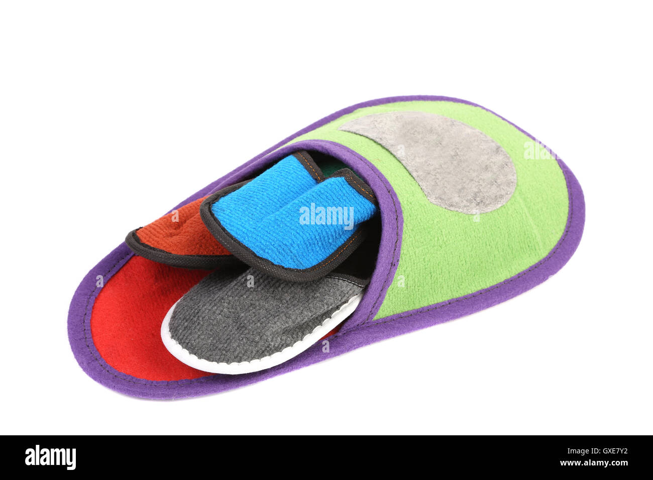 Four small slippers inside a big Stock Photo - Alamy