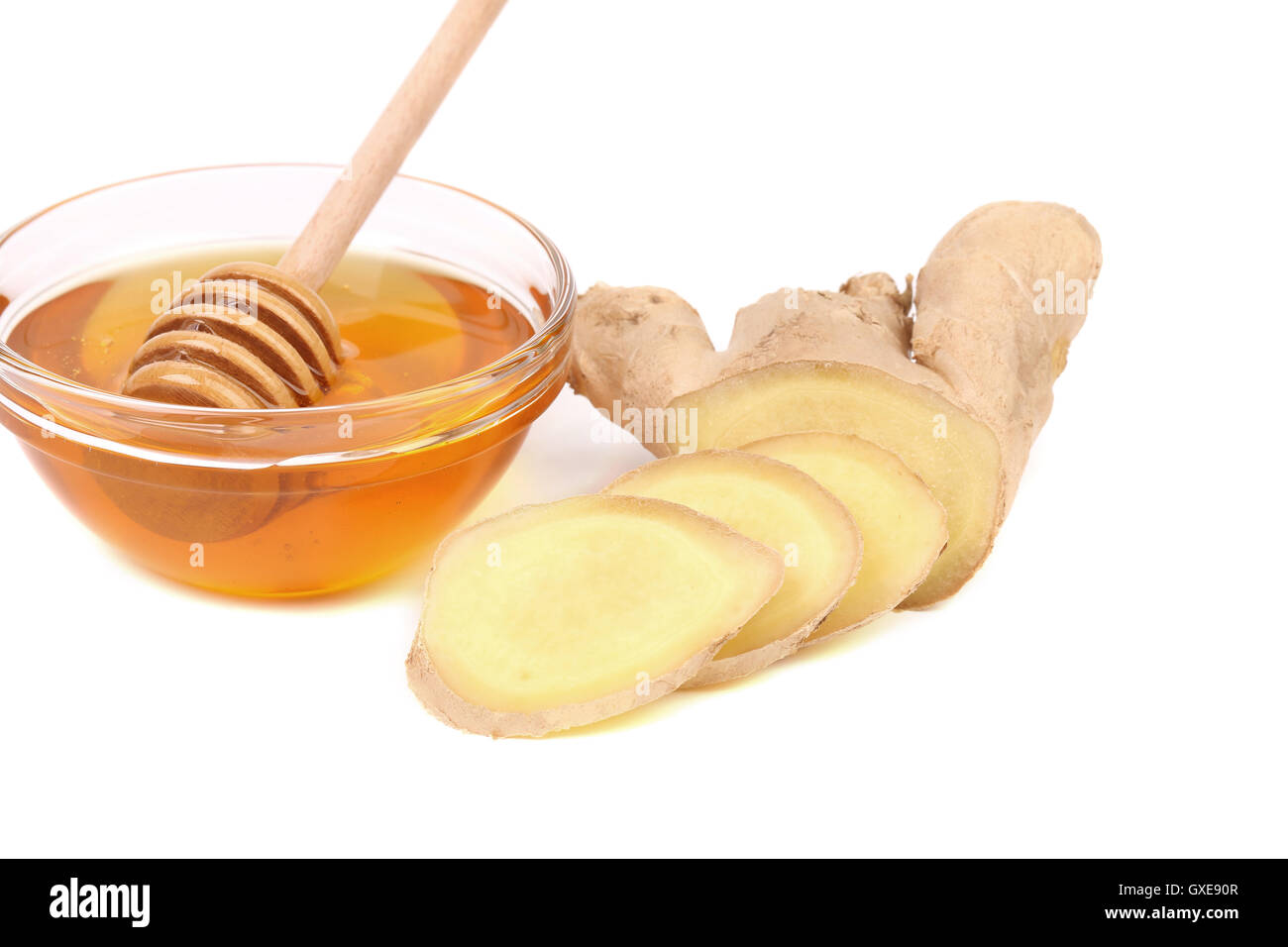 Root Ginger sliced and bow of honey Stock Photo - Alamy