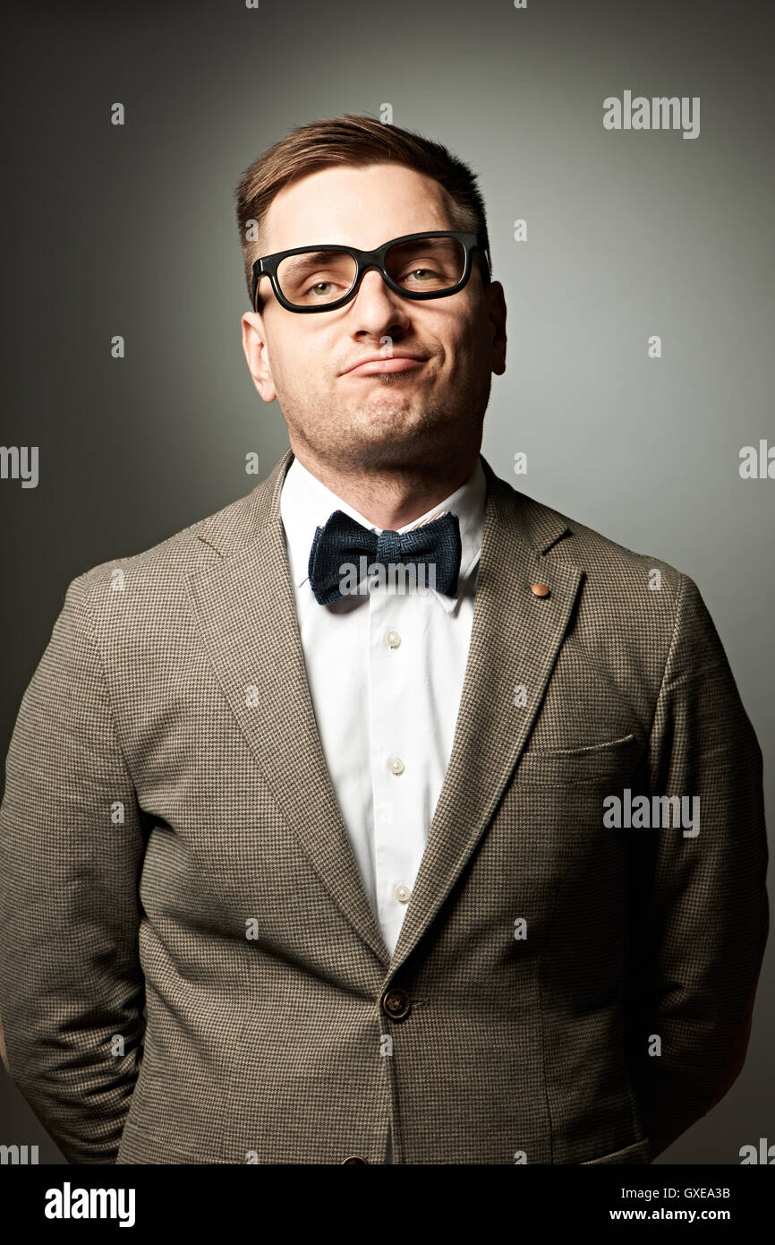 Confident nerd in eyeglasses and bow tie Stock Photo - Alamy