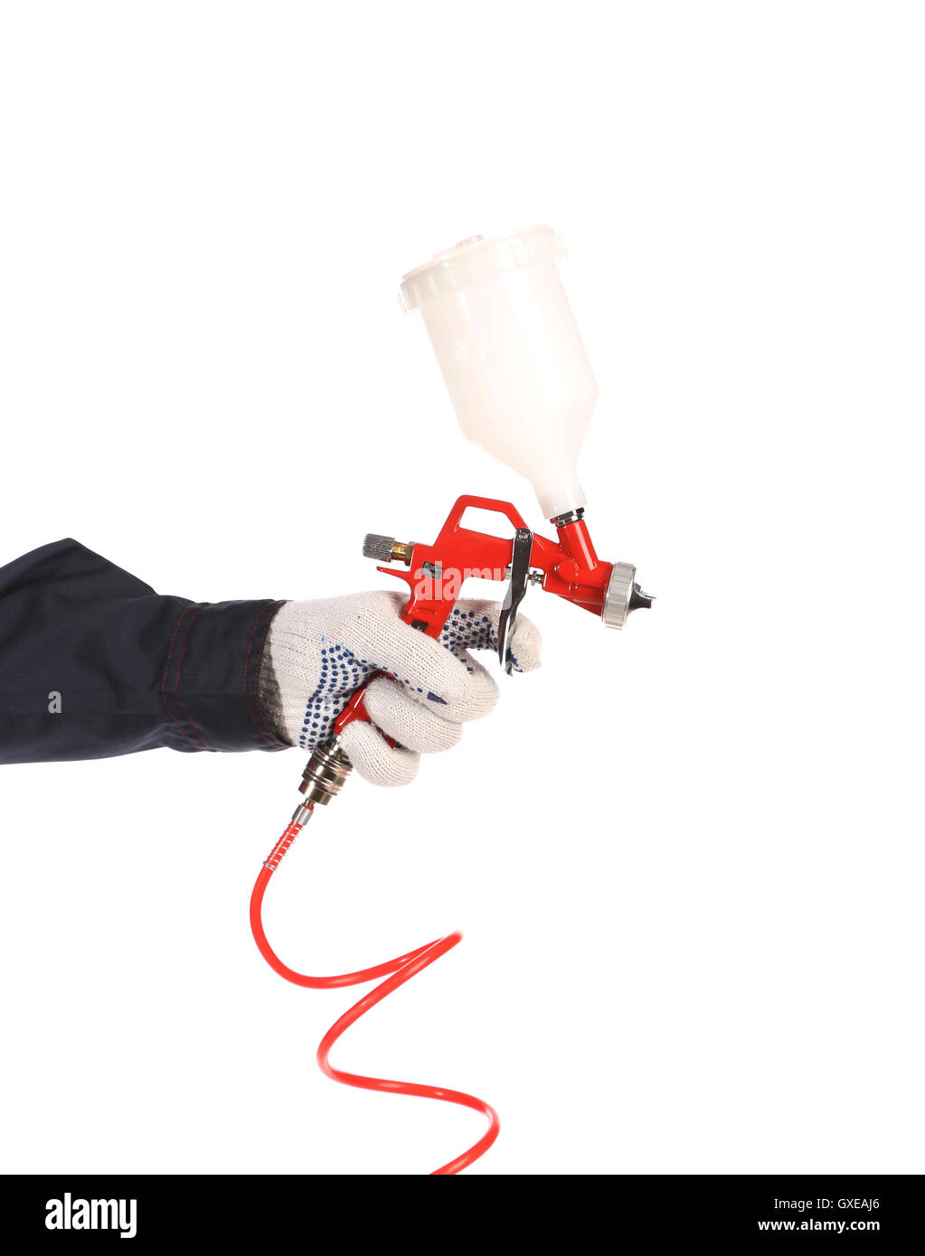 Hand holds spray gun Stock Photo - Alamy