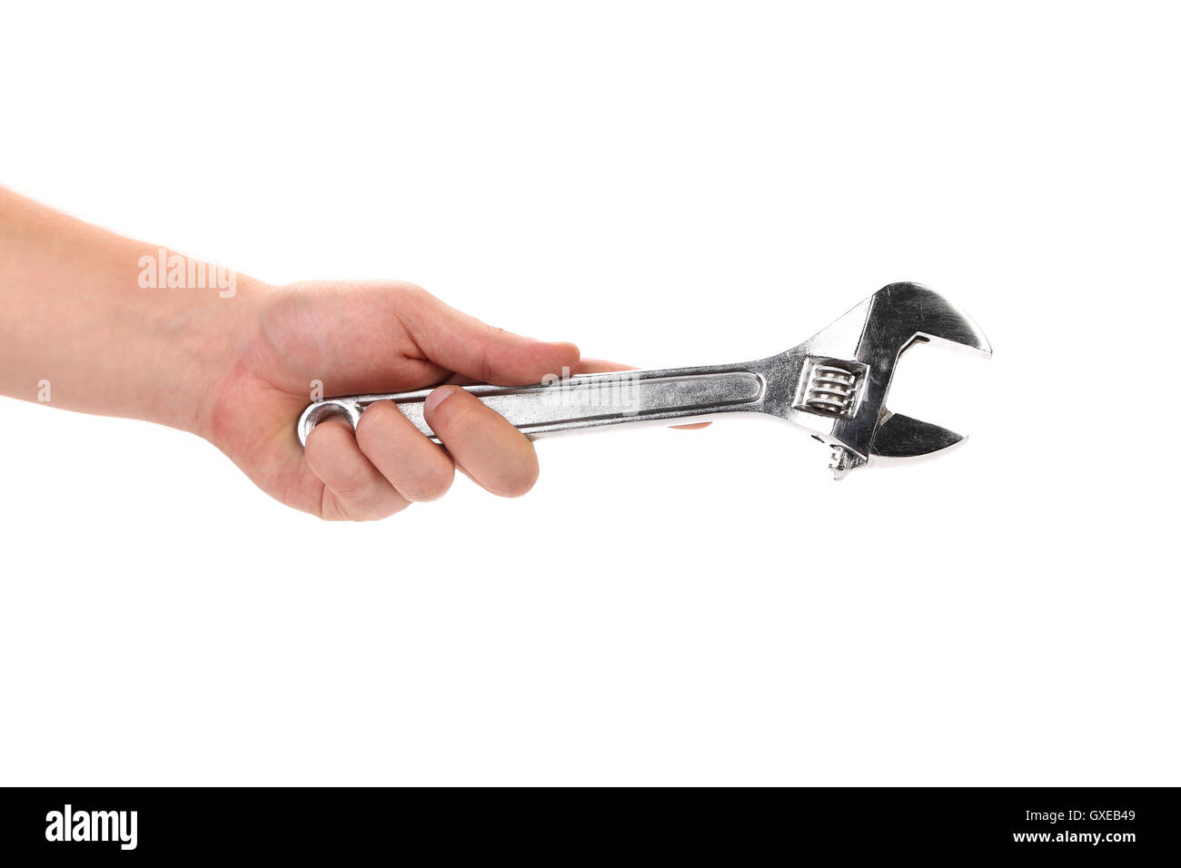 Hand holding adjustable wrench isolated Stock Photo - Alamy