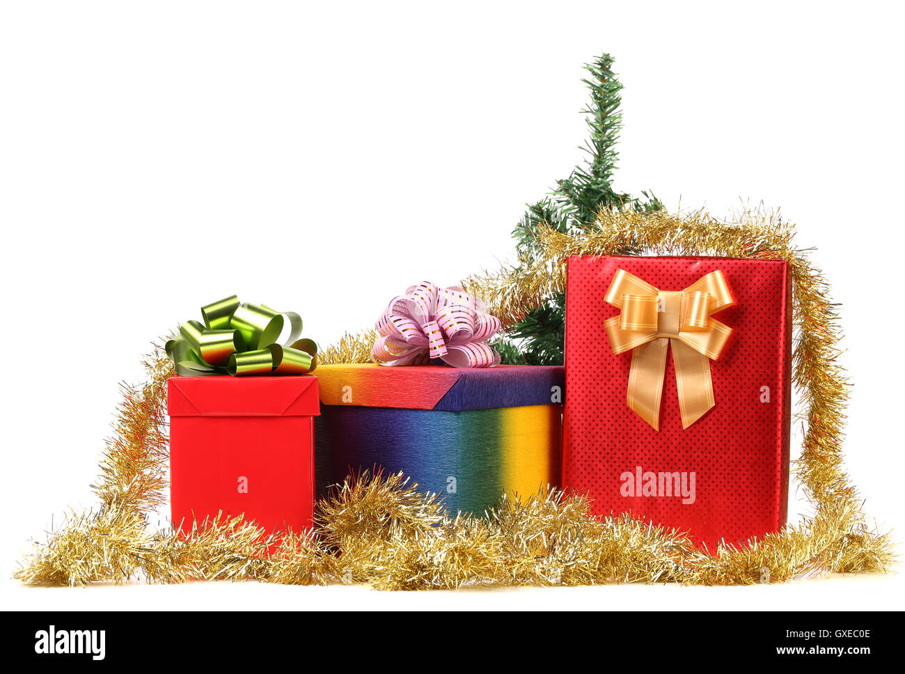 Gift boxes with christmas tinsel Stock Photo - Alamy