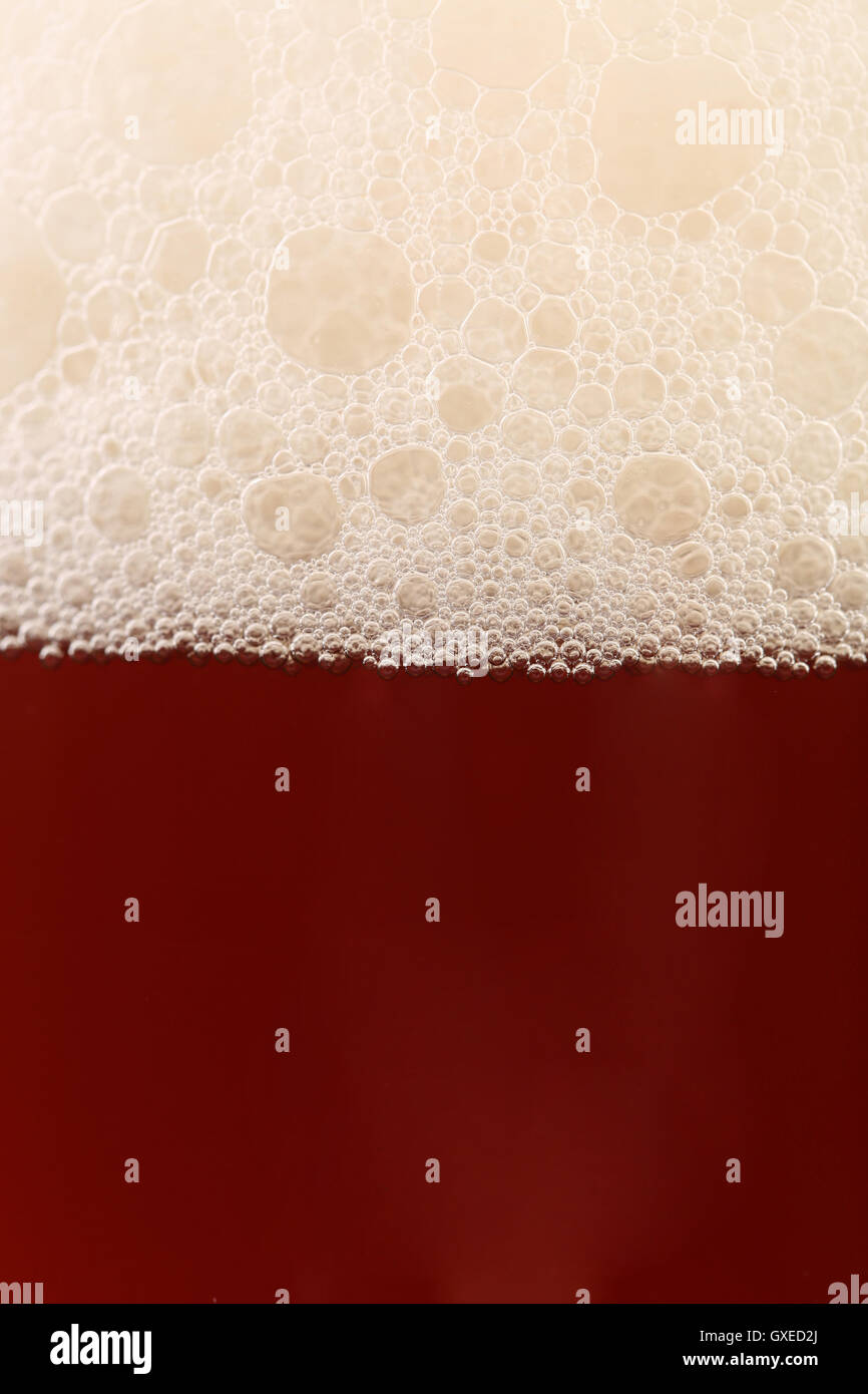 Close up of beer with foam Stock Photo - Alamy