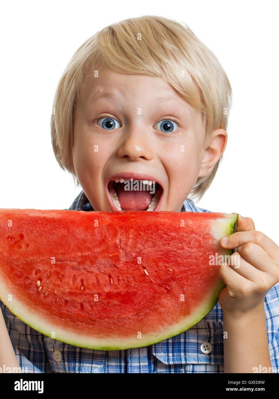 Close-up of boy taking bite of water melon Stock Photo - Alamy