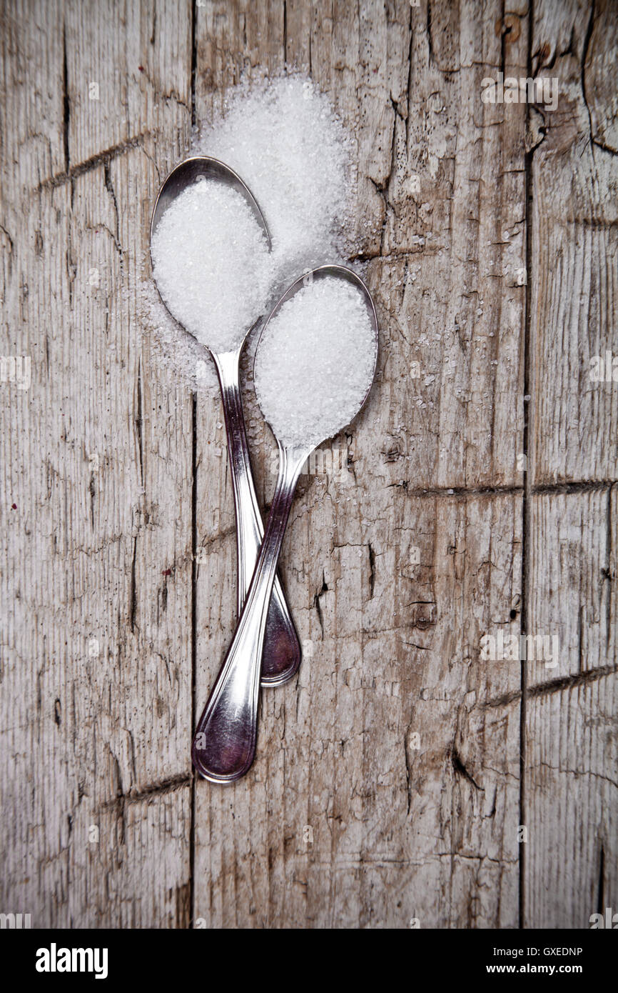 sugar in two spoons Stock Photo - Alamy