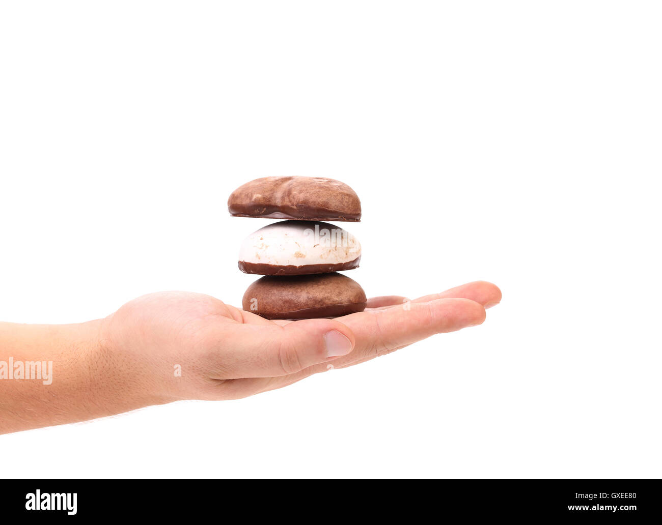 Stack of cookies in hand Stock Photo - Alamy