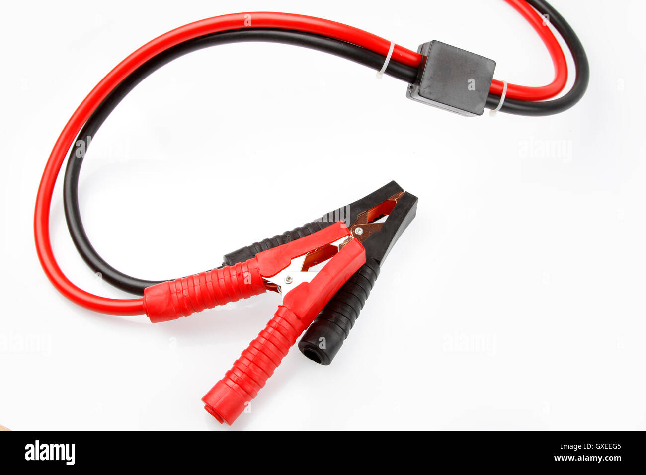 Jumper cables on plain background Stock Photo - Alamy