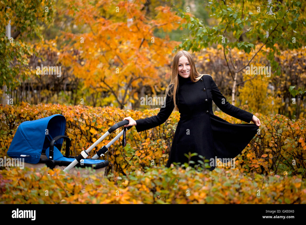 Mother with baby stroller for a newborn Stock Photo - Alamy