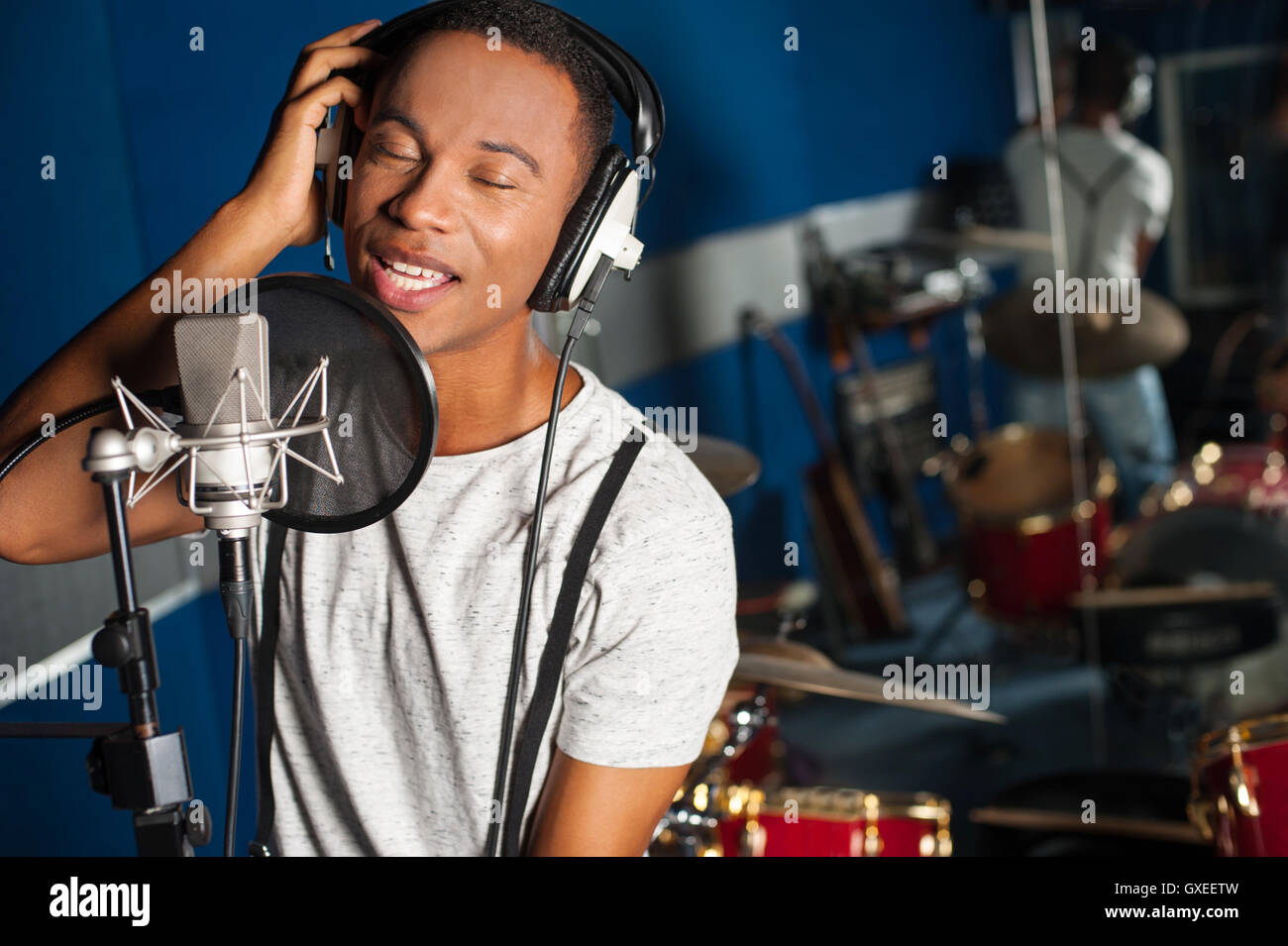 Singer recording a track in studio Stock Photo - Alamy