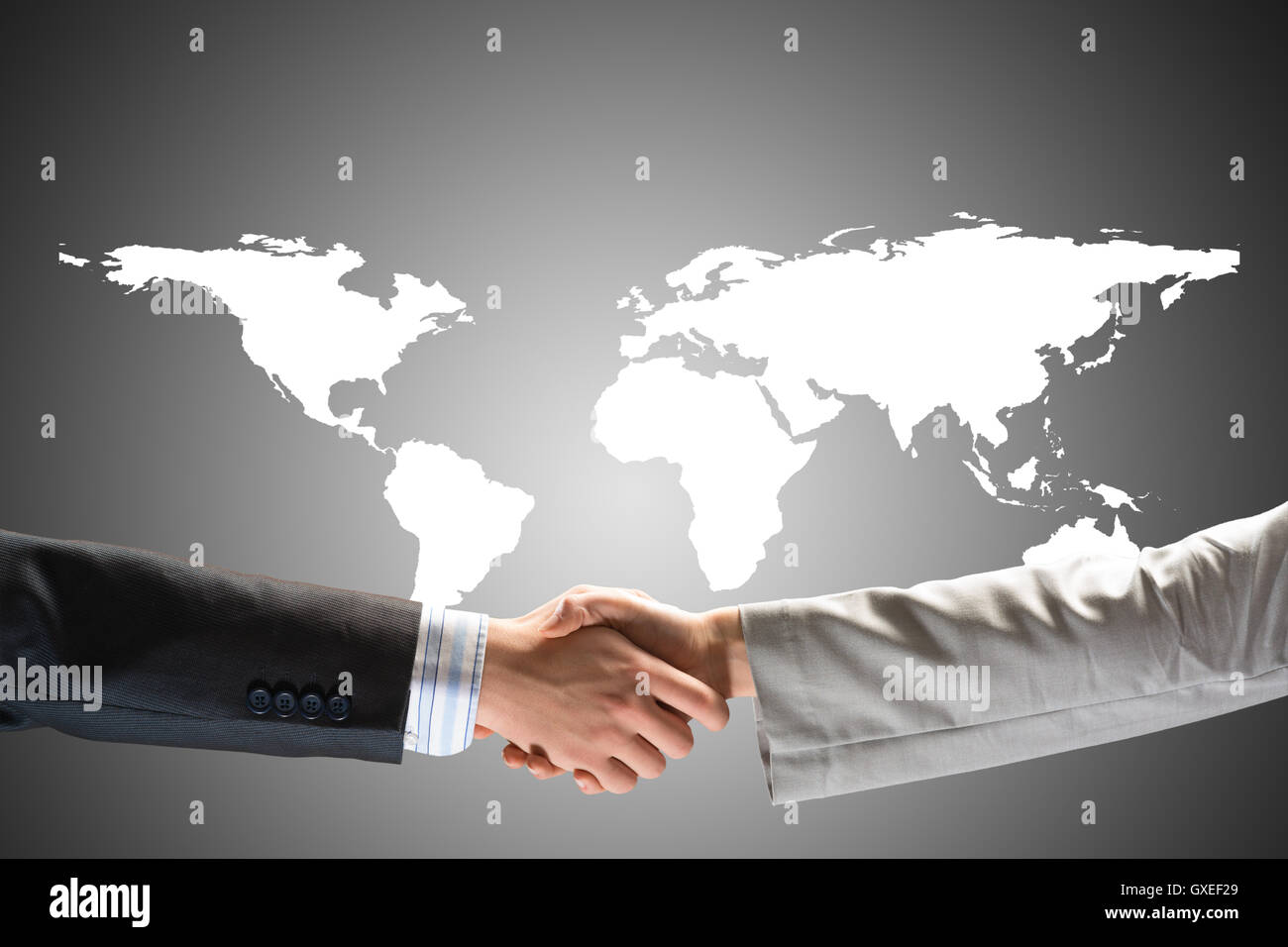 Two businessmen shaking hands Stock Photo - Alamy