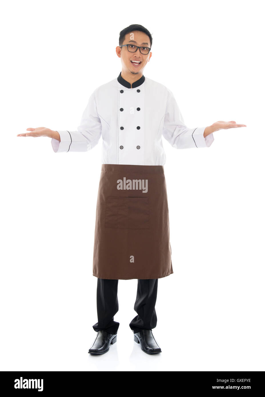 Happy Asian chef welcoming pose Stock Photo - Alamy