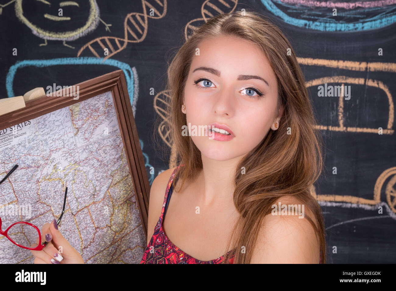 Young student girl in red dress reports on geography classes with u.s.a ...
