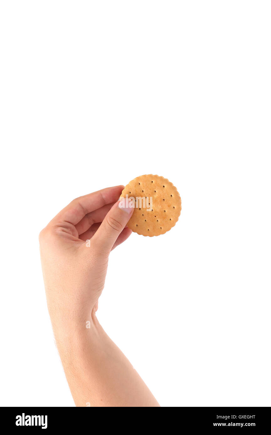 Hand holds cookie biscuits with filling Stock Photo - Alamy
