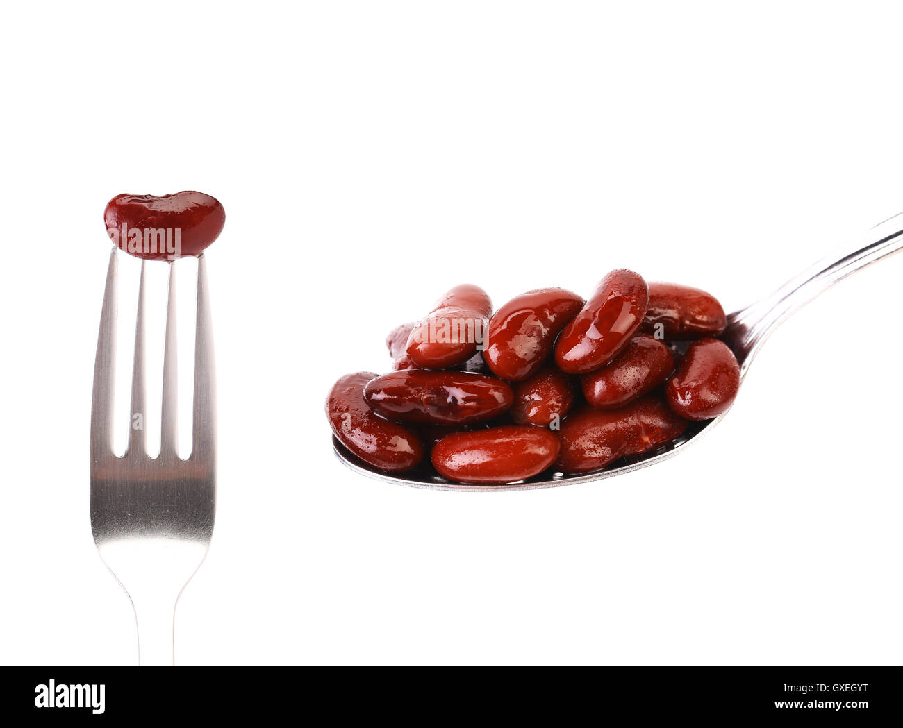 Preserve beans on a spoon and fork Stock Photo - Alamy