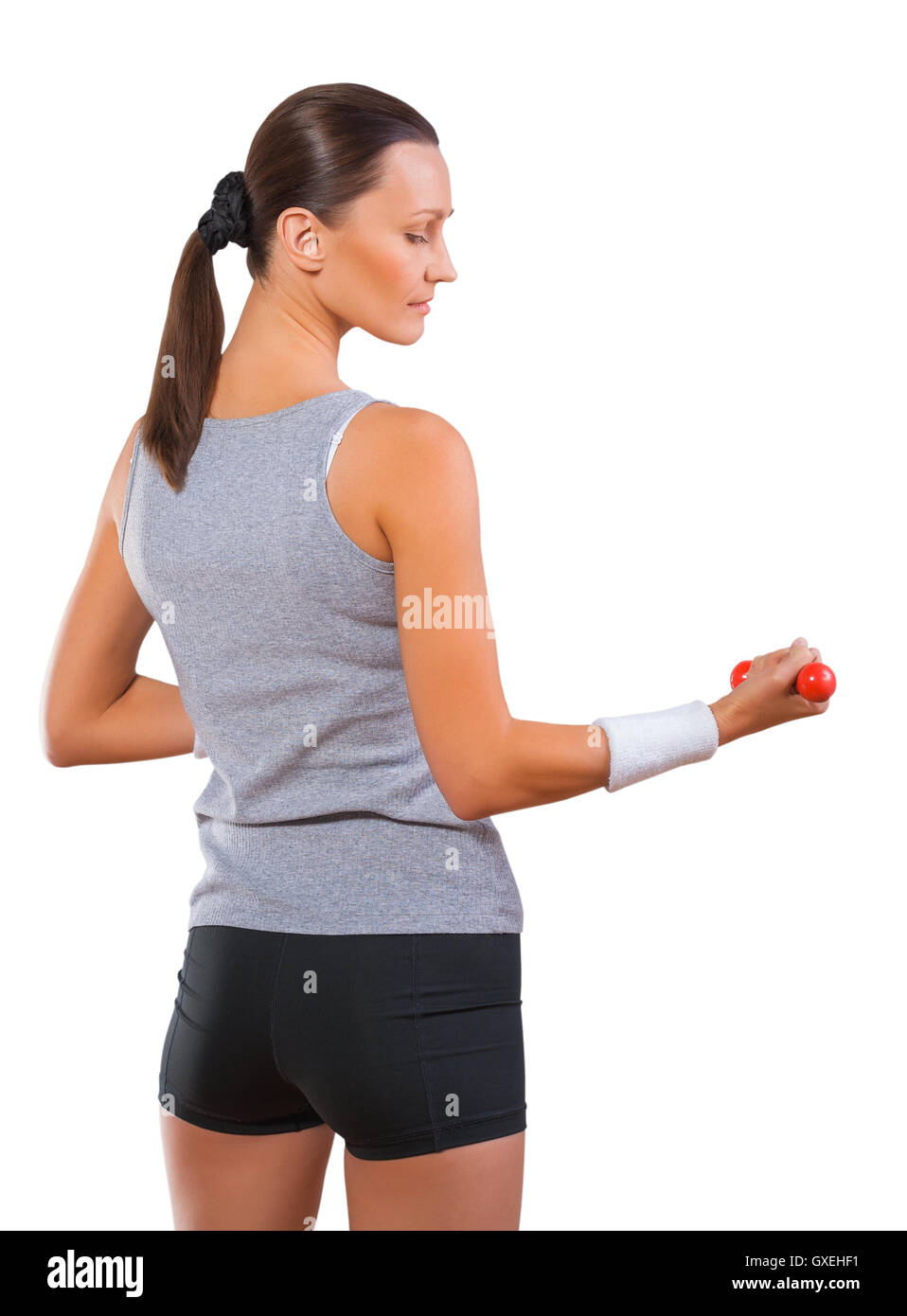 a sportswoman holding small dumbbell isolated Stock Photo - Alamy