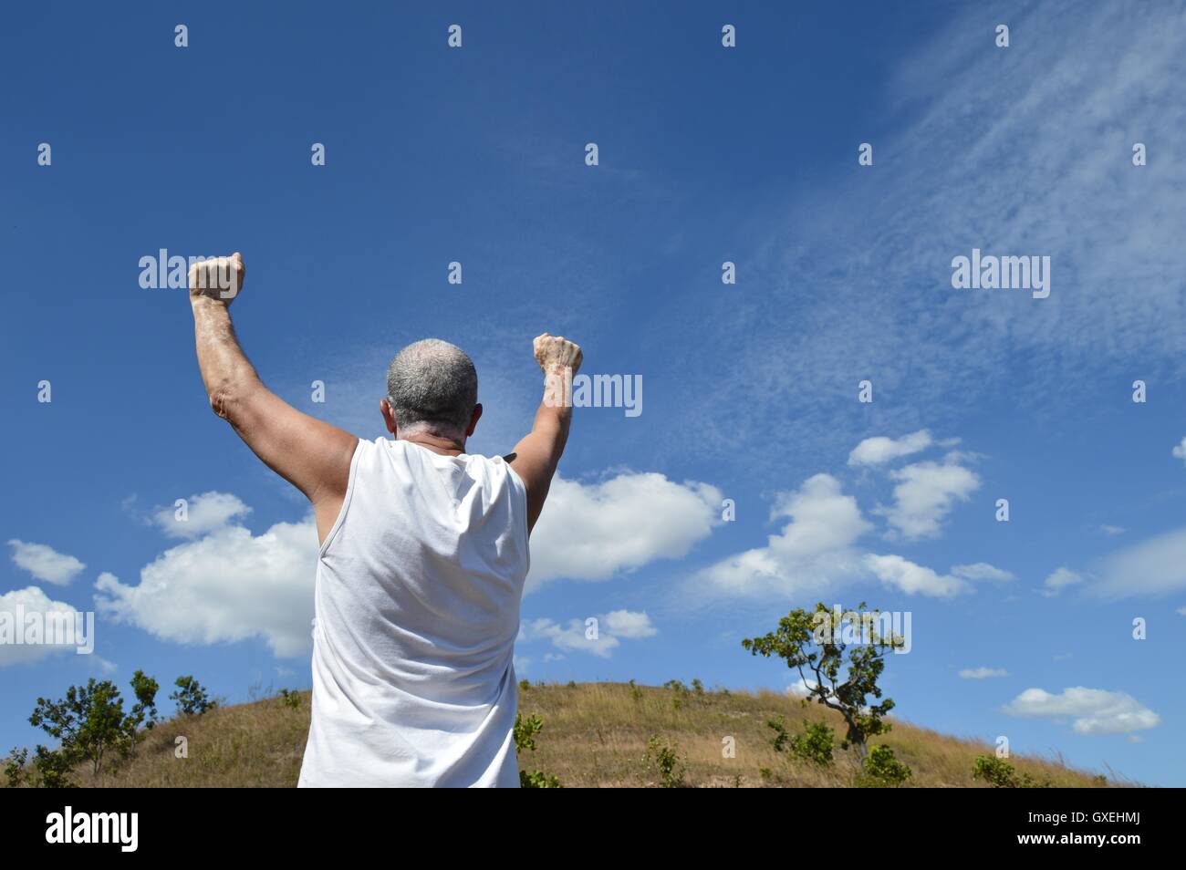 Man with arms up, celebrating hi-res stock photography and images - Alamy