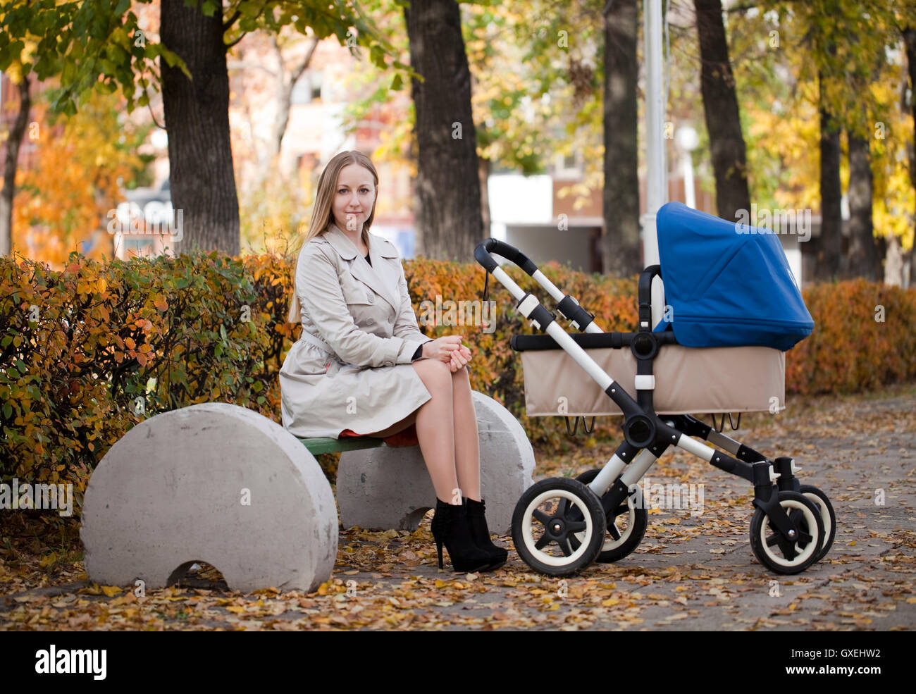 Mother with baby stroller for a newborn Stock Photo - Alamy