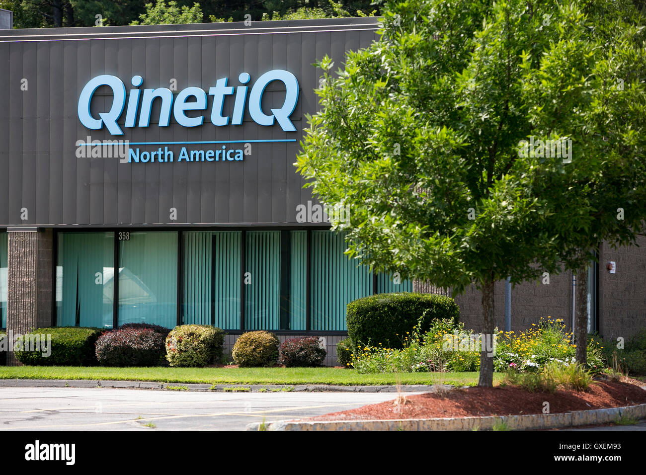 A logo sign outside of the headquarters of QinetiQ North America in ...