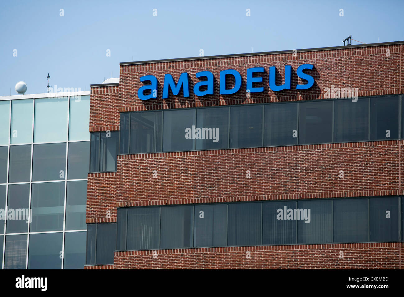 A logo sign outside of a facility occupied by the Amadeus IT Group in ...
