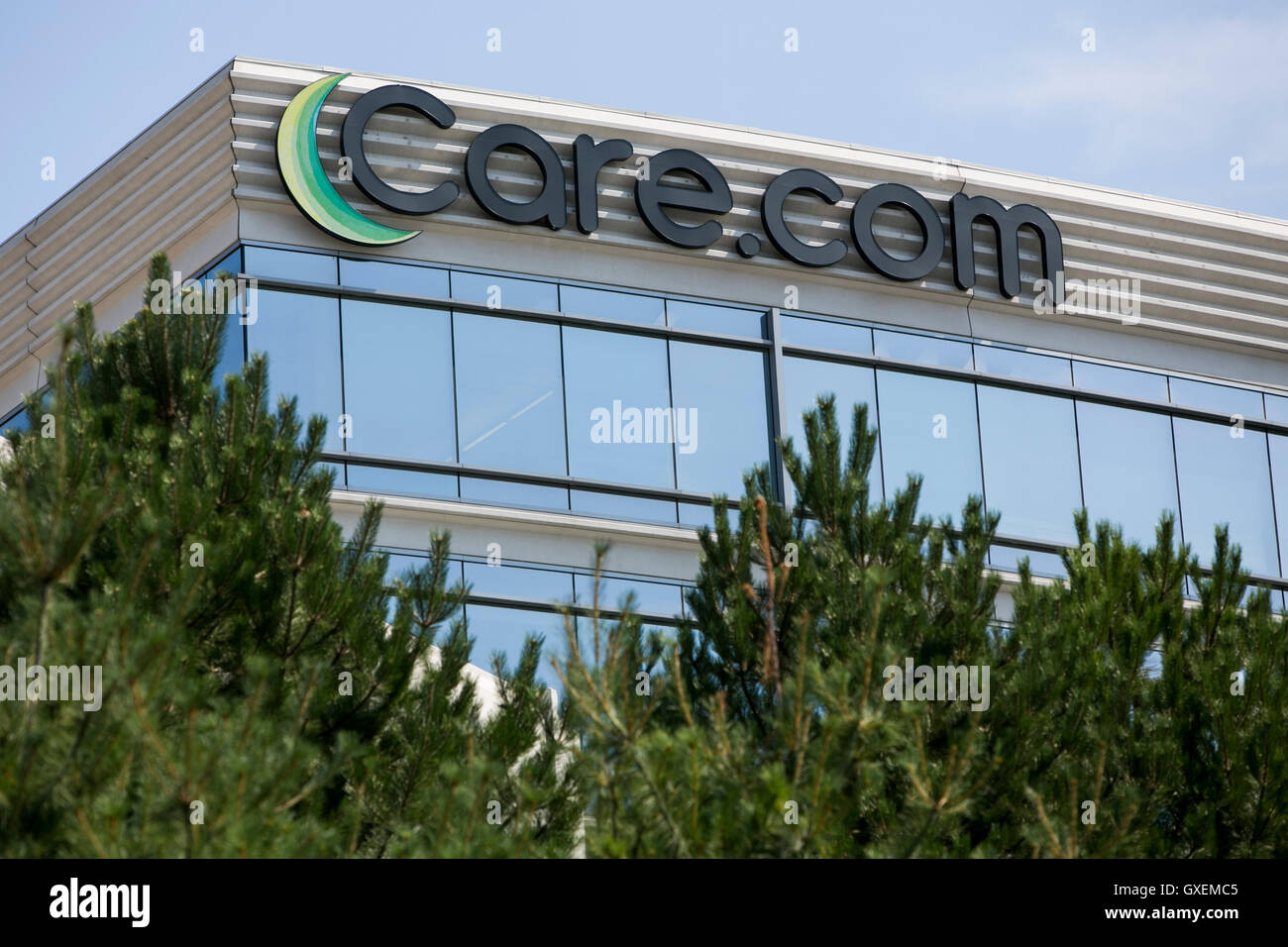 A logo sign outside of the headquarters of Care.com in Waltham ...