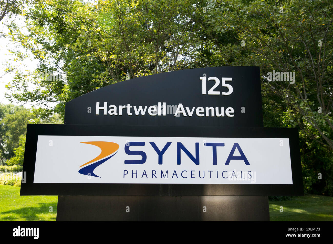 A logo sign outside of a facility occupied by the Synta Pharmaceuticals ...
