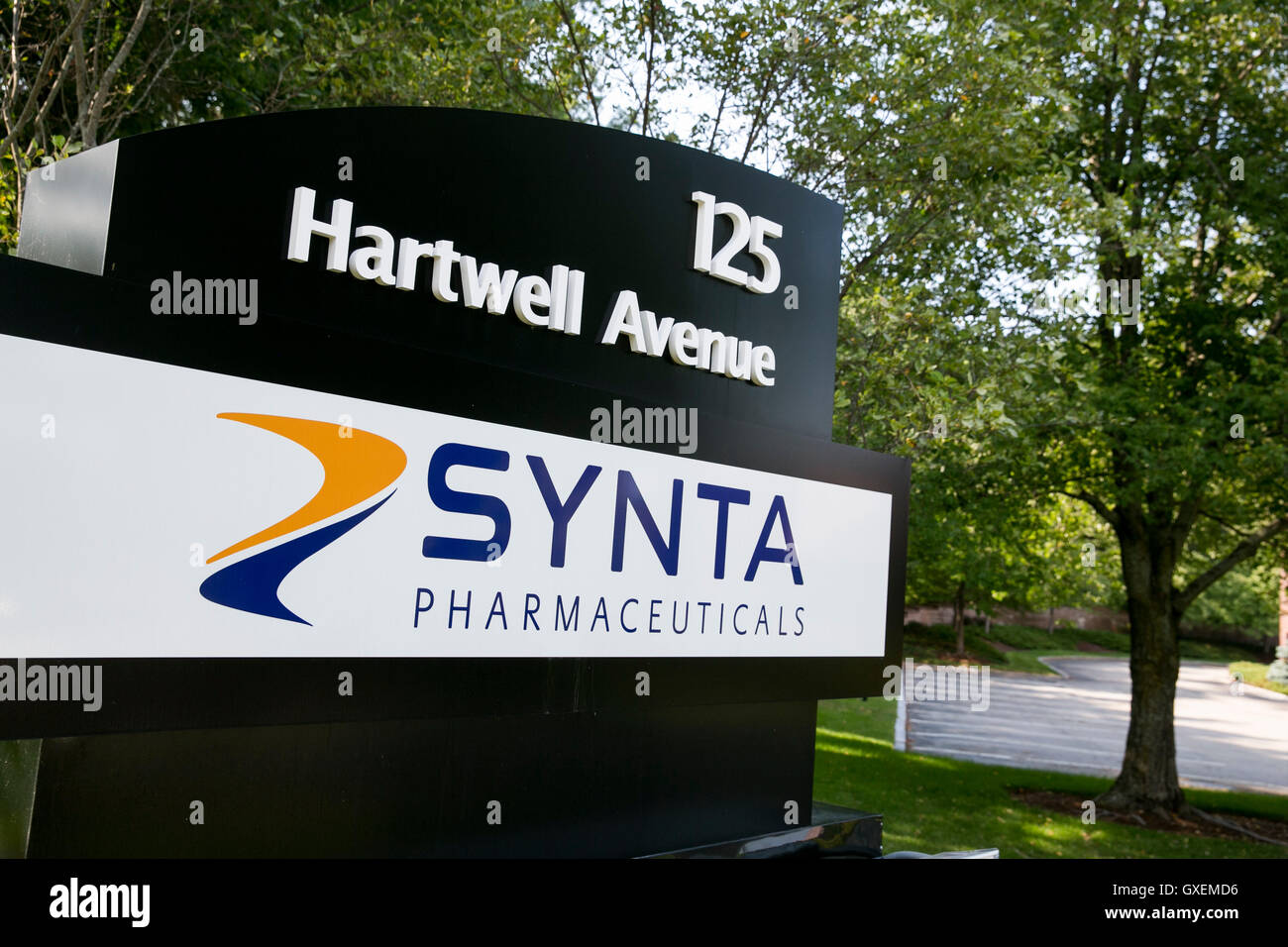 A logo sign outside of a facility occupied by the Synta Pharmaceuticals ...