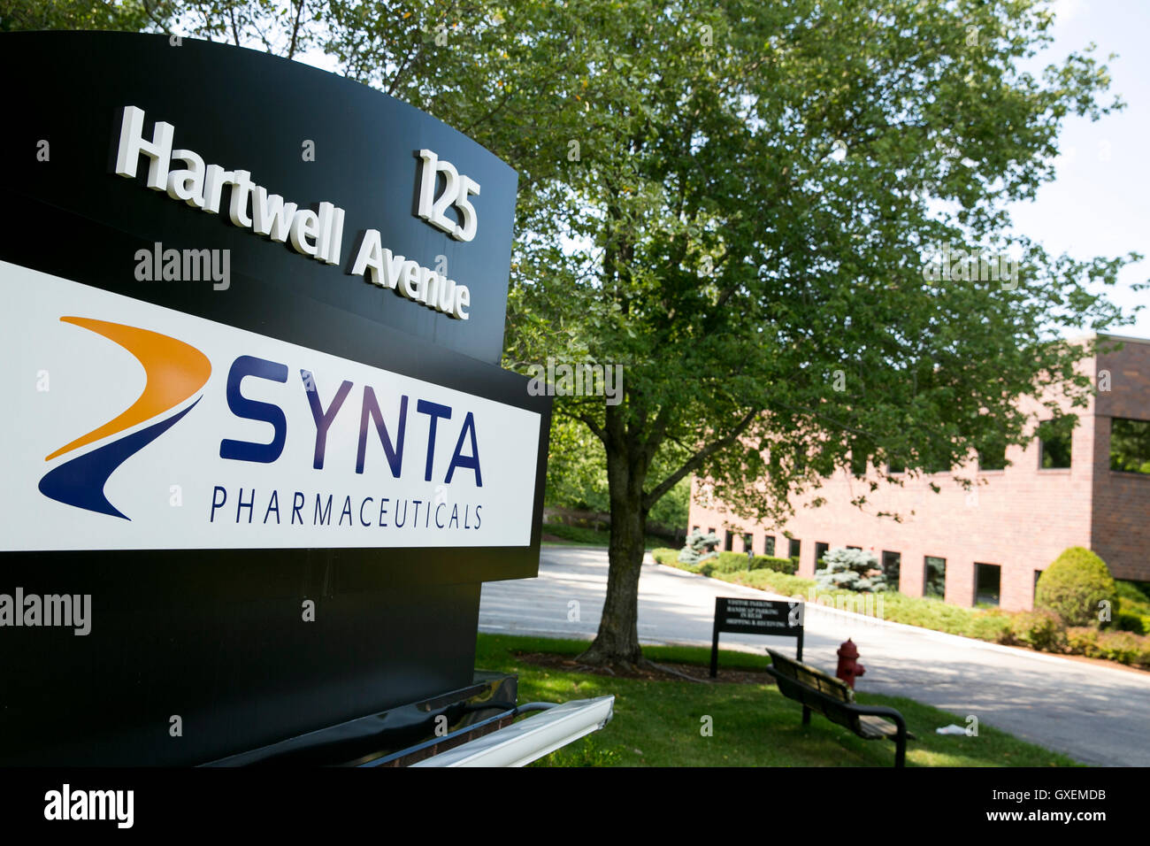 A logo sign outside of a facility occupied by the Synta Pharmaceuticals ...