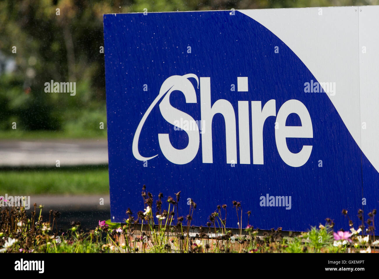 A logo sign outside of a facility occupied by Shire Plc., in Lexington ...