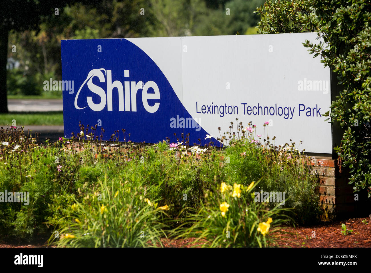 A logo sign outside of a facility occupied by Shire Plc., in Lexington ...