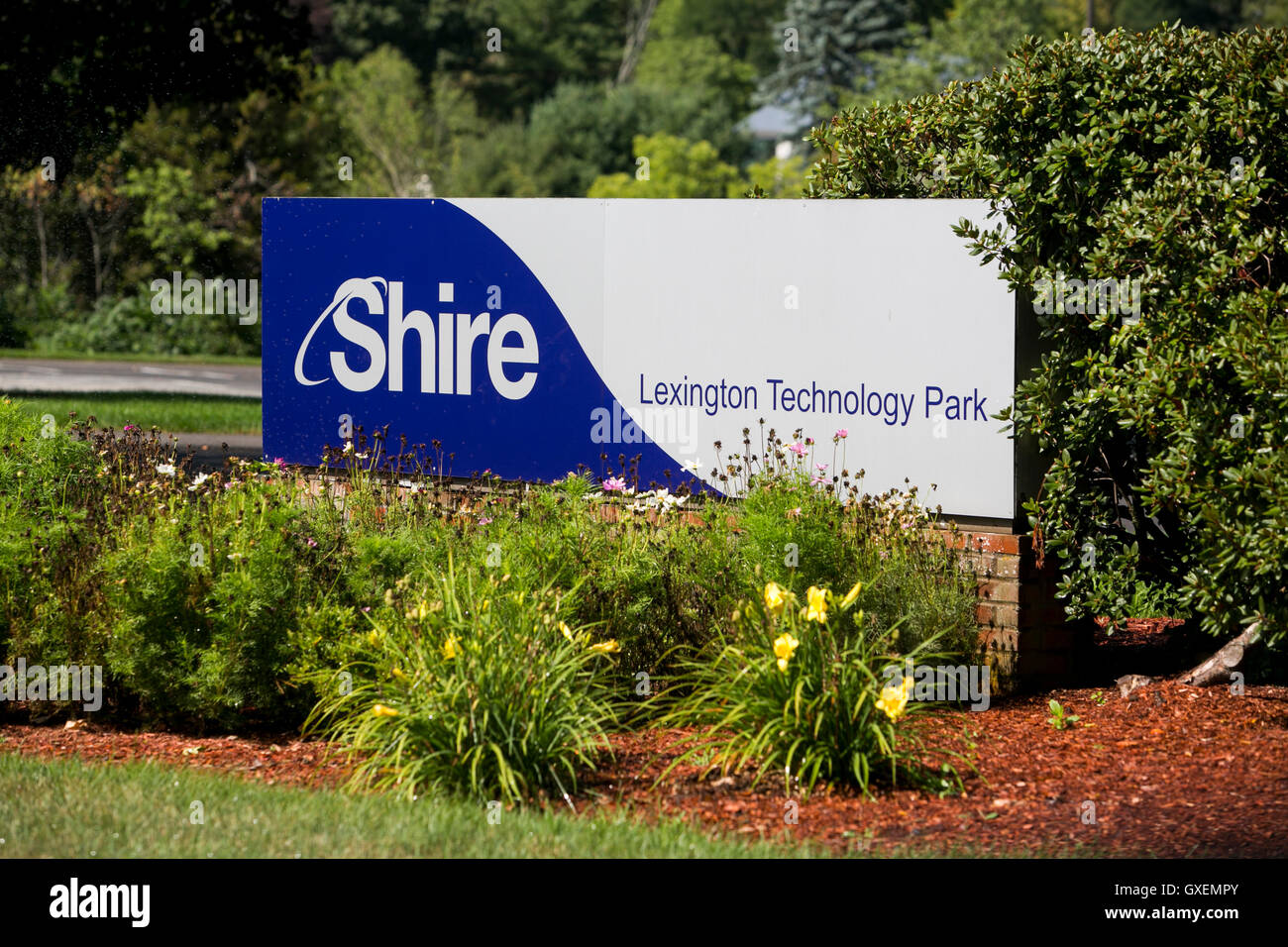 A logo sign outside of a facility occupied by Shire Plc., in Lexington ...