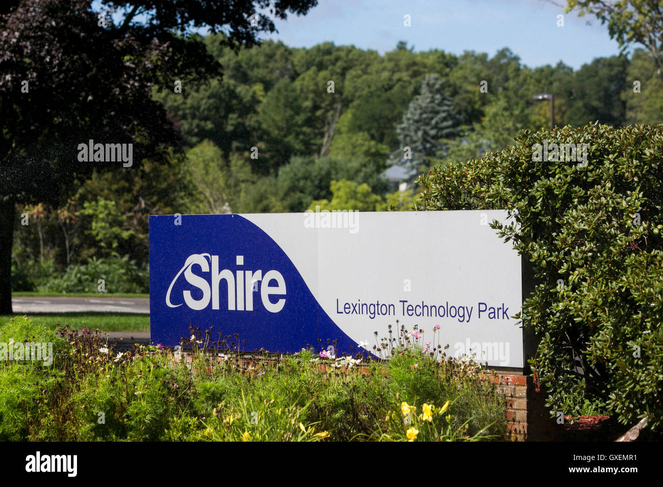 A logo sign outside of a facility occupied by Shire Plc., in Lexington ...