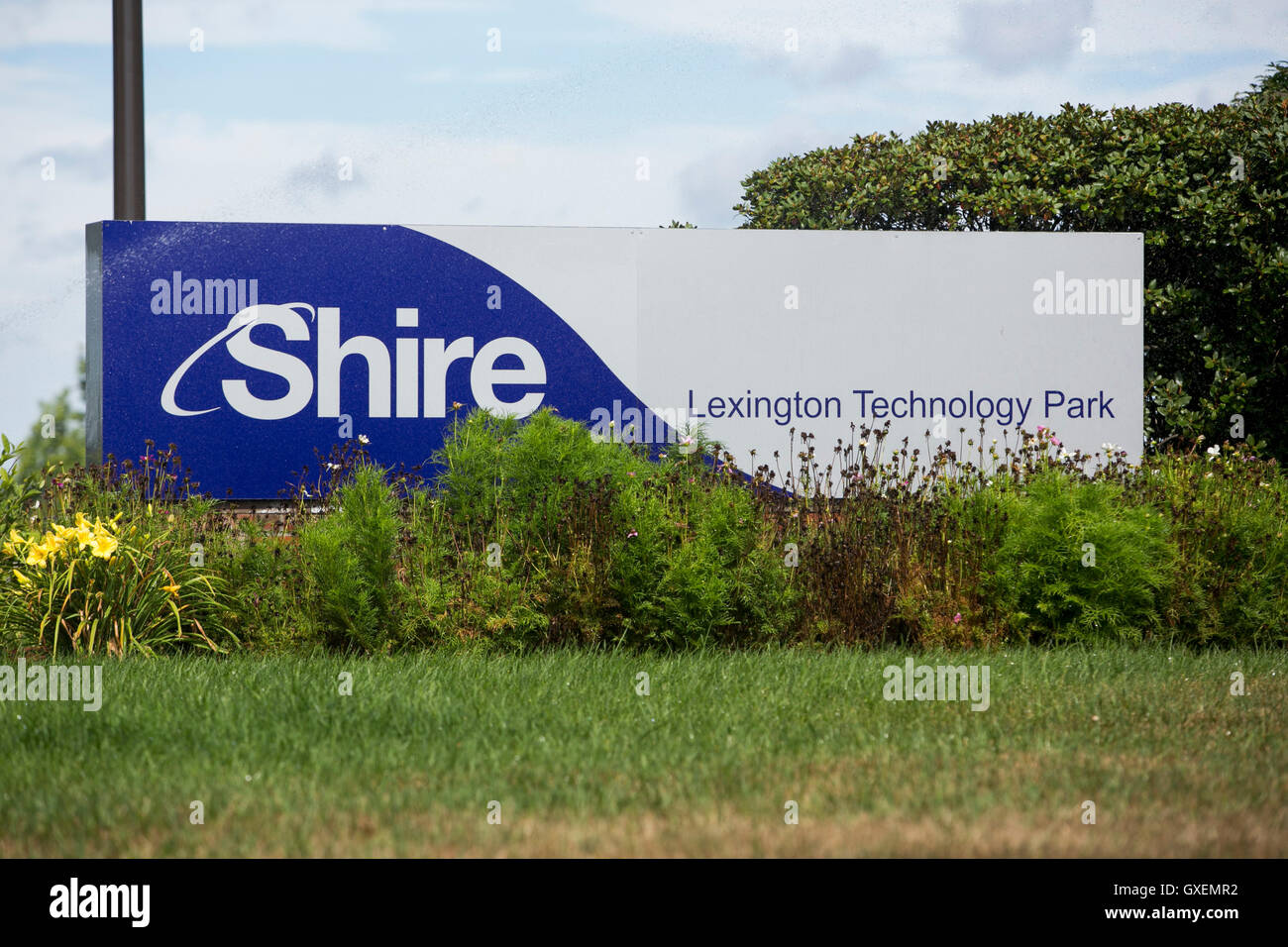 A logo sign outside of a facility occupied by Shire Plc., in Lexington ...