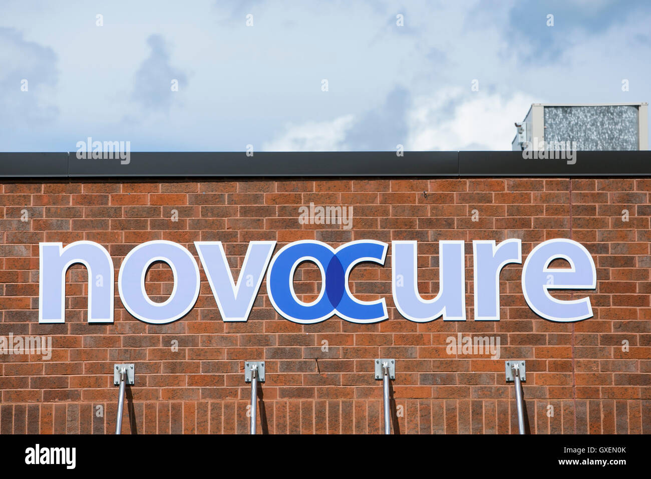 A logo sign outside of a facility occupied by Novocure in Portsmouth ...